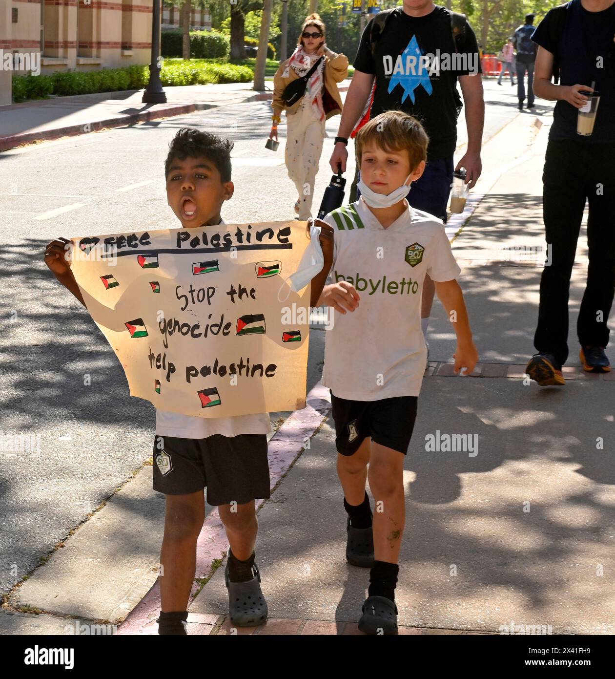 A pro-Palestinian demonstrator walks outside an encampment cordoned off ...