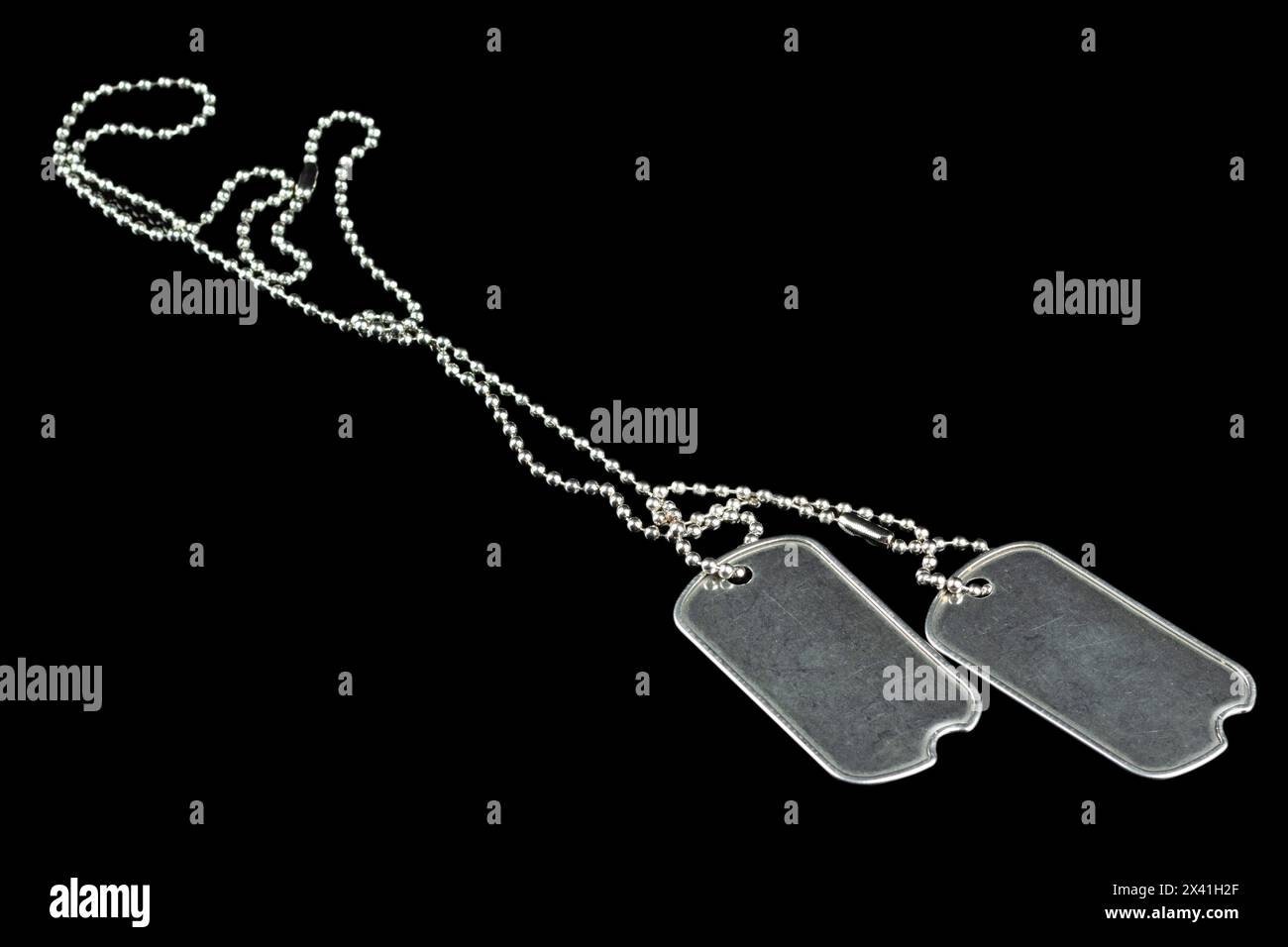 US army dog tags on black background Stock Photo - Alamy