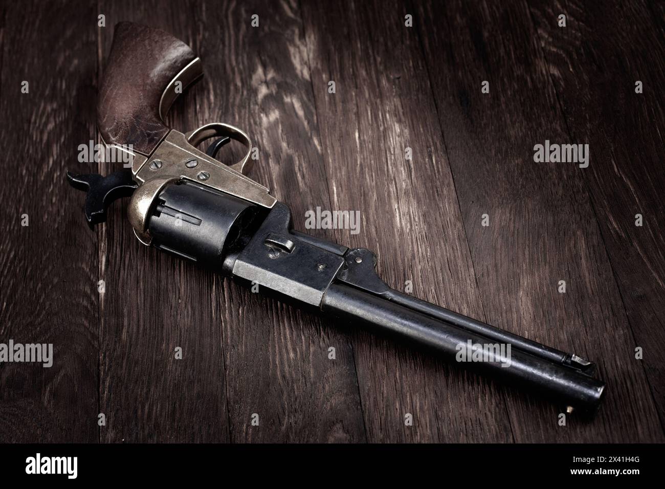 Old West gun. Percussion Army Revolver on wooden table Stock Photo - Alamy