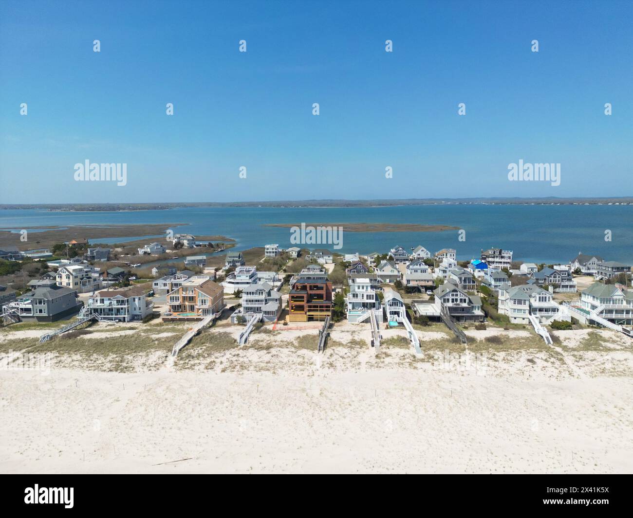 view of luxury homes along the beach in the Hamptons Long Island New ...
