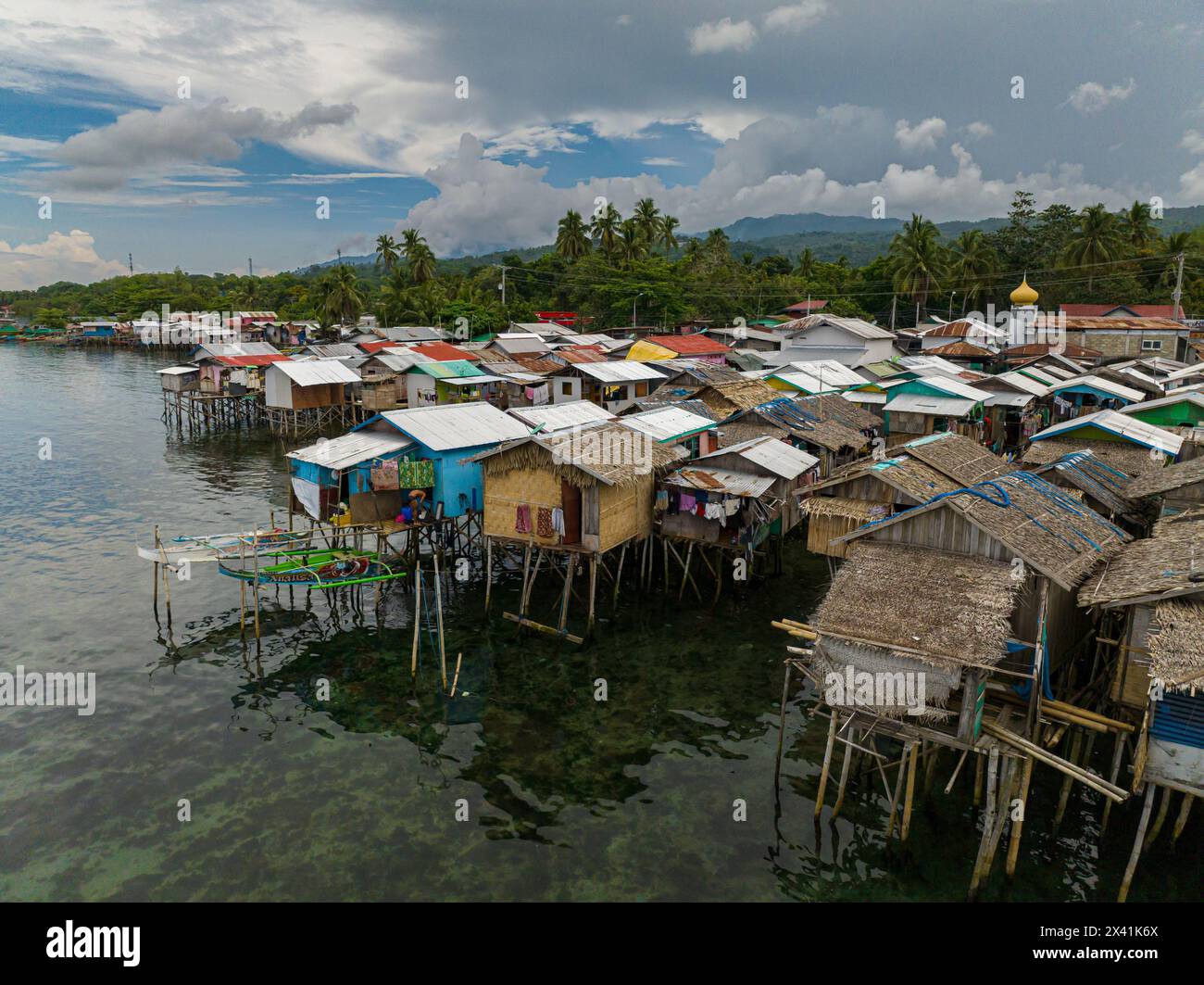 Top view of Stilt houses in the Zamboanga coastline. Clear turquoise ...