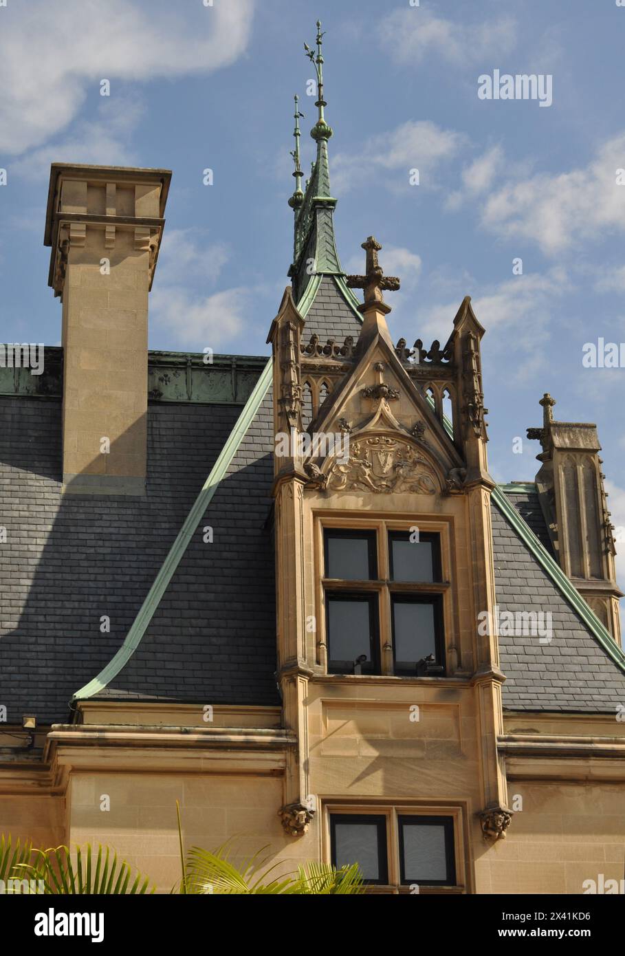 Looking Upwards at a Decorative Dormer window Flanked by a Chimney and ...
