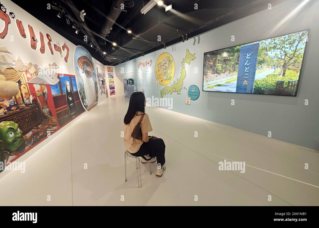 SHANGHAI, CHINA - APRIL 24, 2024 - A Miyazaki Hayao fan watches a ...