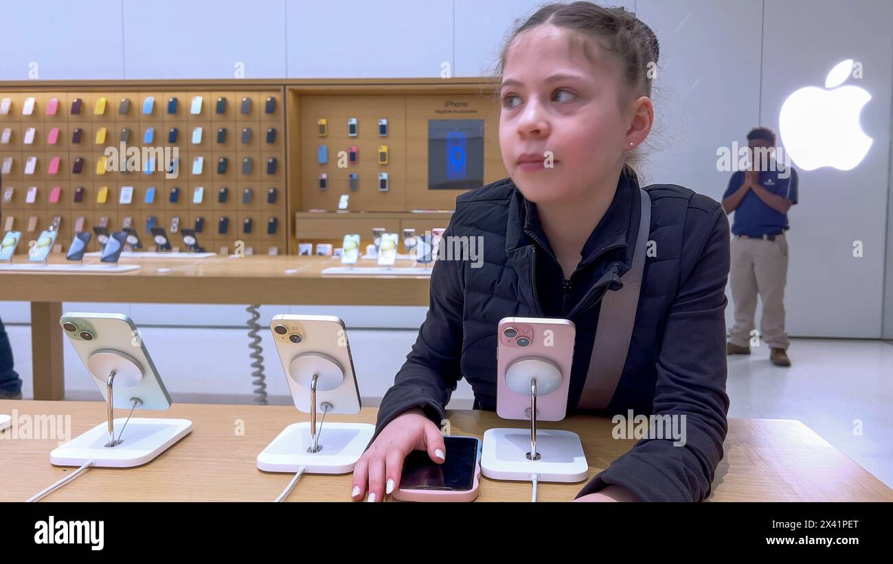 Little Girl Exploring New iPhones at Apple Store in Park Meadows Mall ...