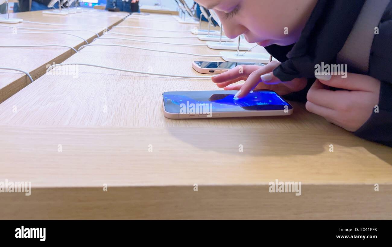 Little Girl Exploring New iPhones at Apple Store in Park Meadows Mall ...