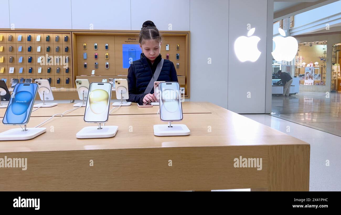 Little Girl Exploring New iPhones at Apple Store in Park Meadows Mall ...