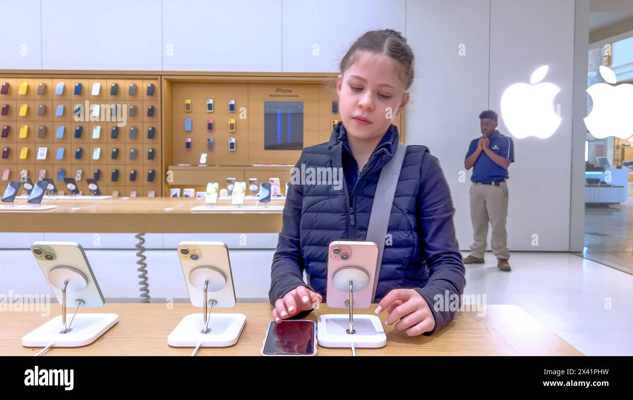 Little Girl Exploring New iPhones at Apple Store in Park Meadows Mall ...
