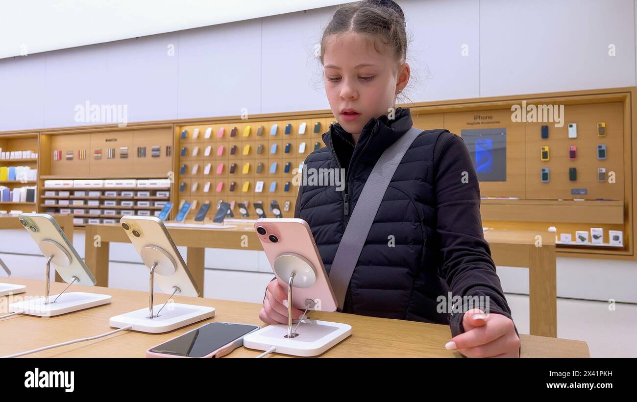 Little Girl Exploring New iPhones at Apple Store in Park Meadows Mall ...