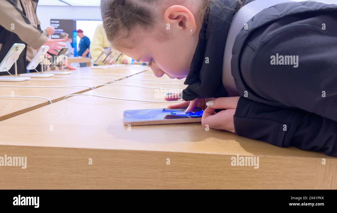 Little Girl Exploring New iPhones at Apple Store in Park Meadows Mall ...