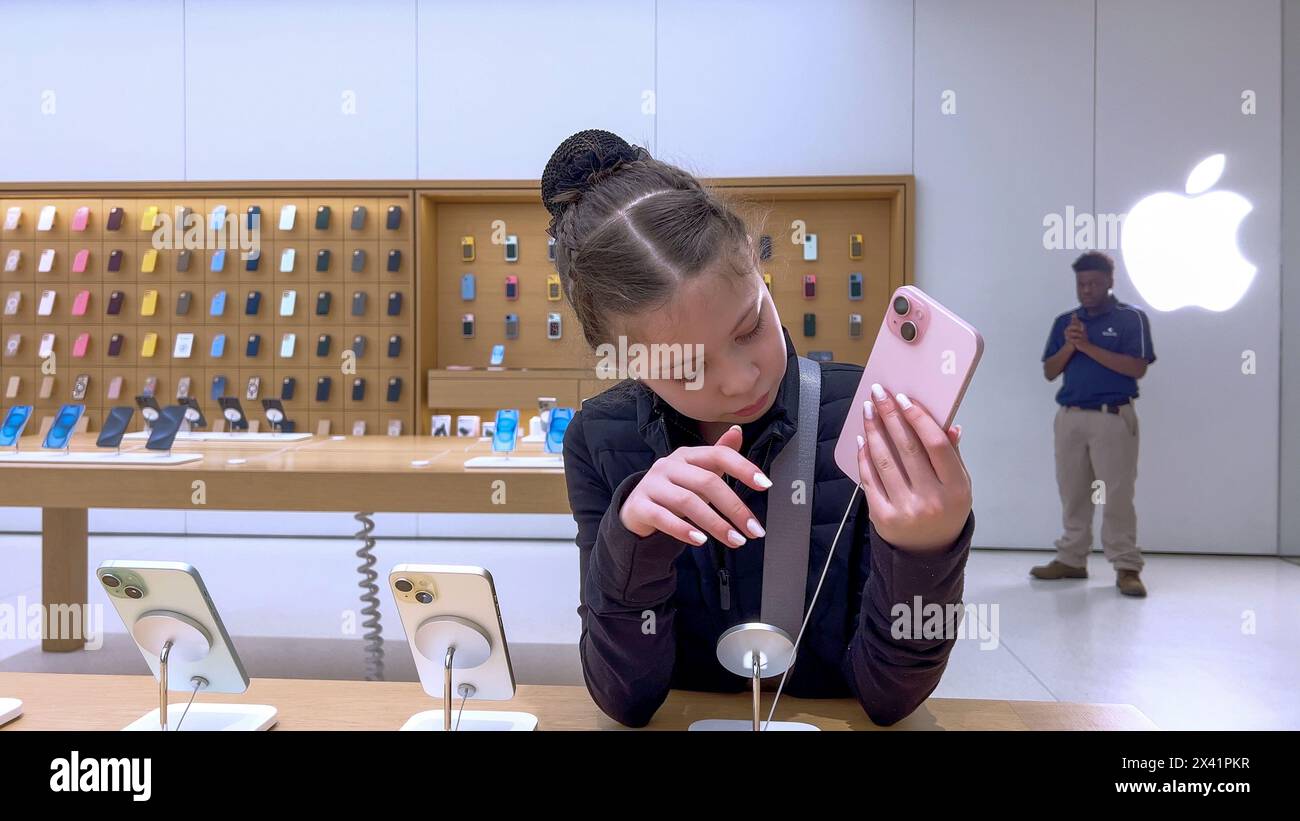 Little Girl Exploring New iPhones at Apple Store in Park Meadows Mall ...