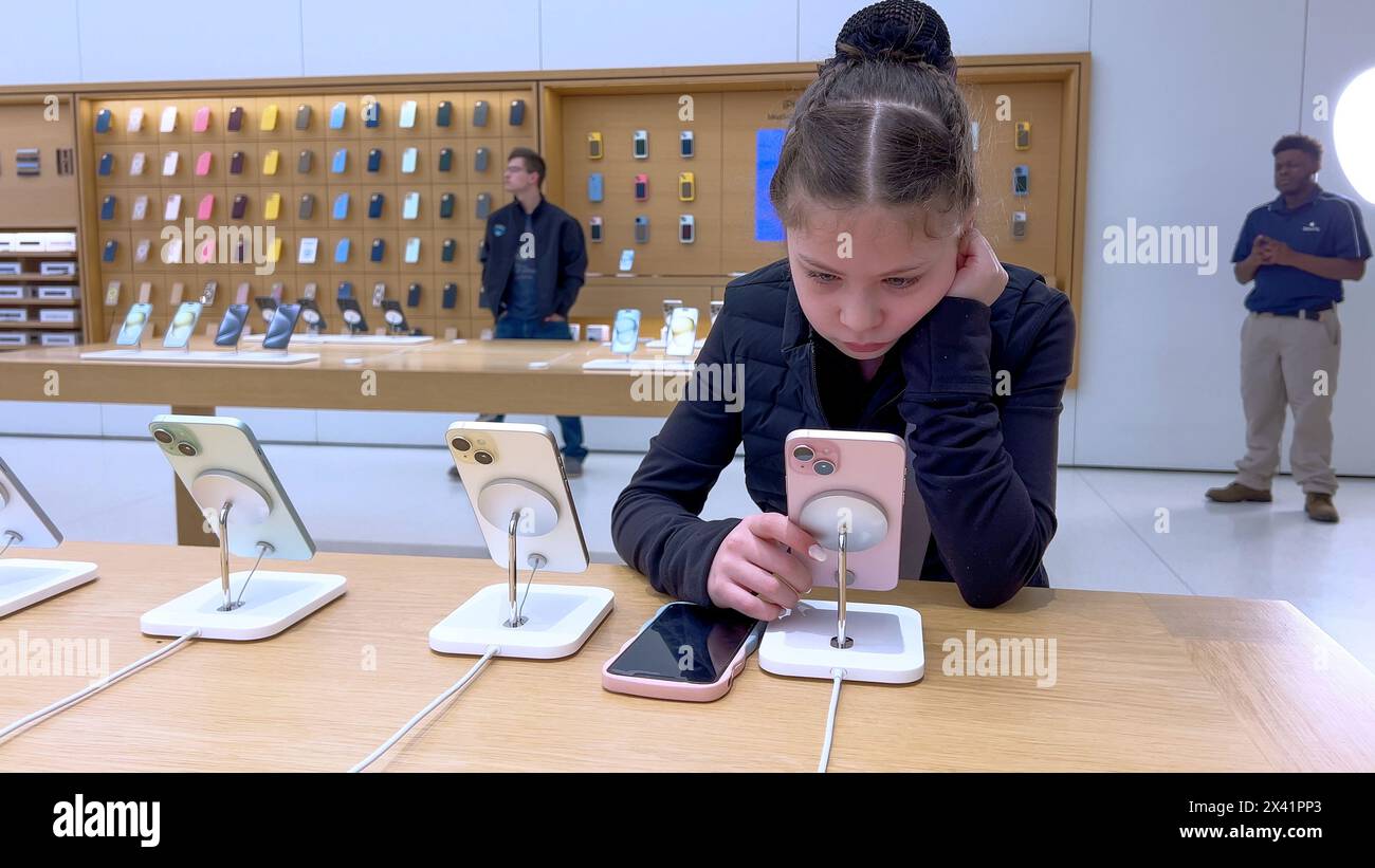 Little Girl Exploring New iPhones at Apple Store in Park Meadows Mall ...