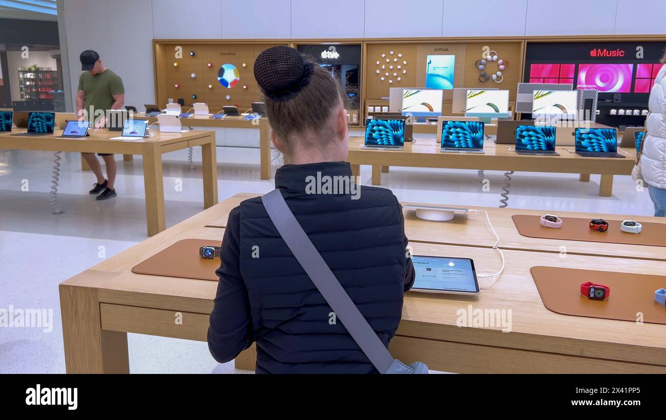 Little Girl Exploring New iPhones at Apple Store in Park Meadows Mall ...