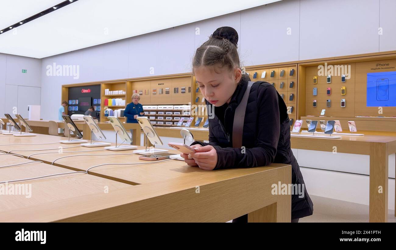 Little Girl Exploring New iPhones at Apple Store in Park Meadows Mall ...