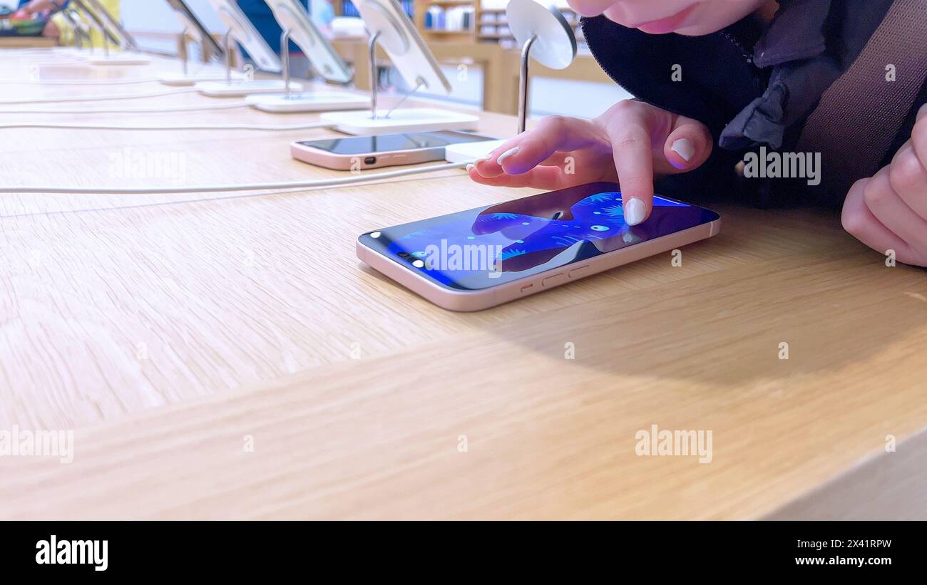Little Girl Exploring New iPhones at Apple Store in Park Meadows Mall ...