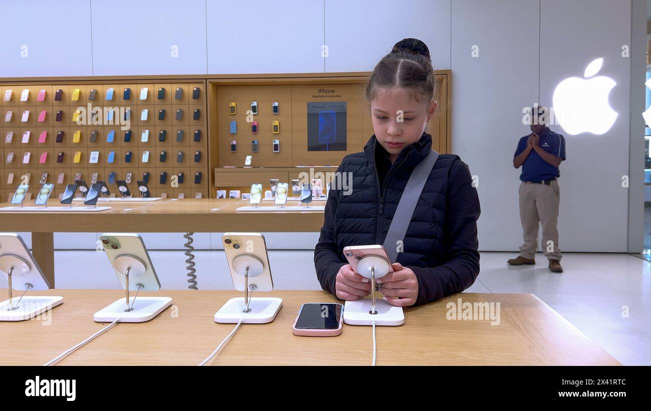 Little Girl Exploring New iPhones at Apple Store in Park Meadows Mall ...