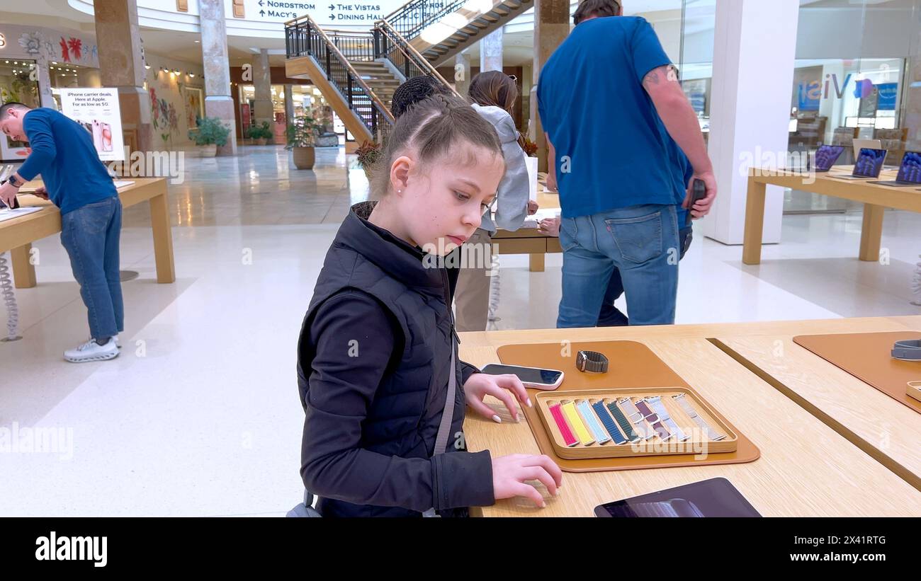 Little Girl Exploring New iPhones at Apple Store in Park Meadows Mall ...