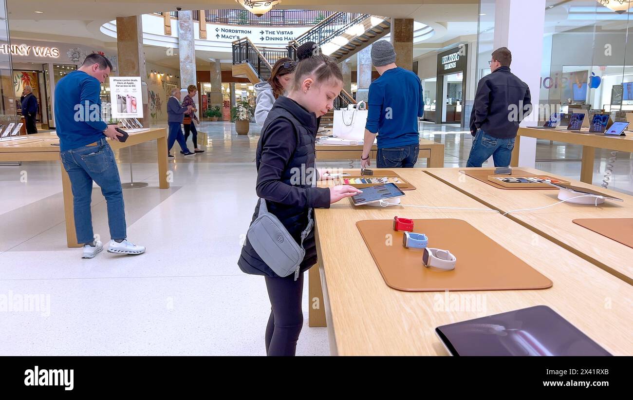 Little Girl Exploring New iPhones at Apple Store in Park Meadows Mall ...
