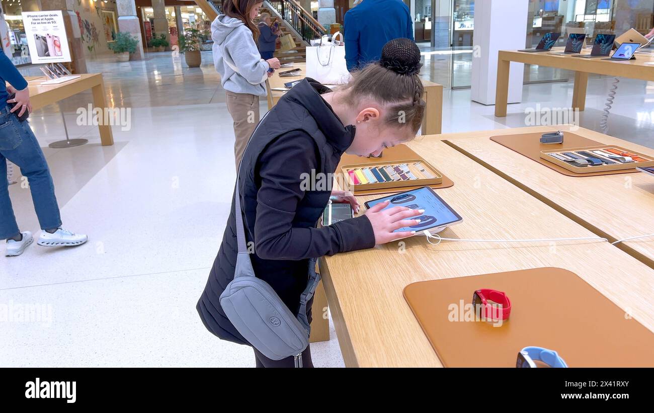 Little Girl Exploring New iPhones at Apple Store in Park Meadows Mall ...