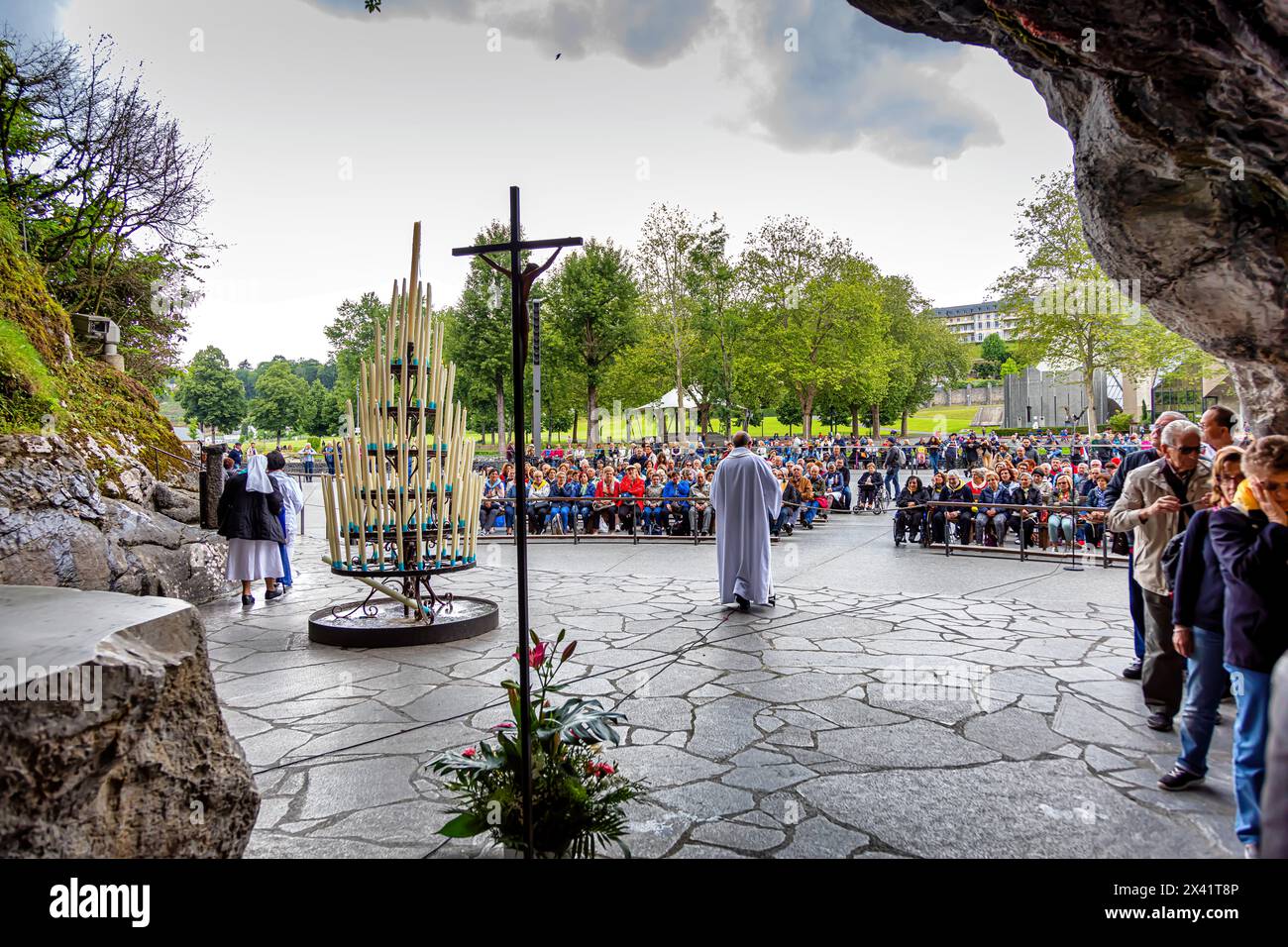 LOURDES - JUNE 15, 2019: Pilgrimage of believers in front of the holy ...