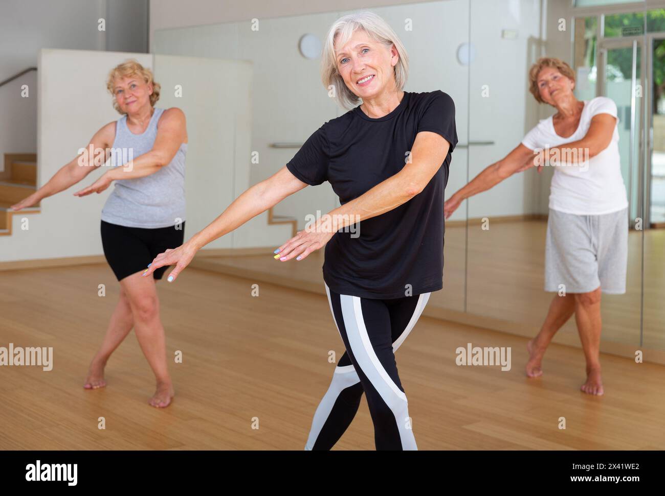 Mature women practice active dancing in the studio Stock Photo - Alamy