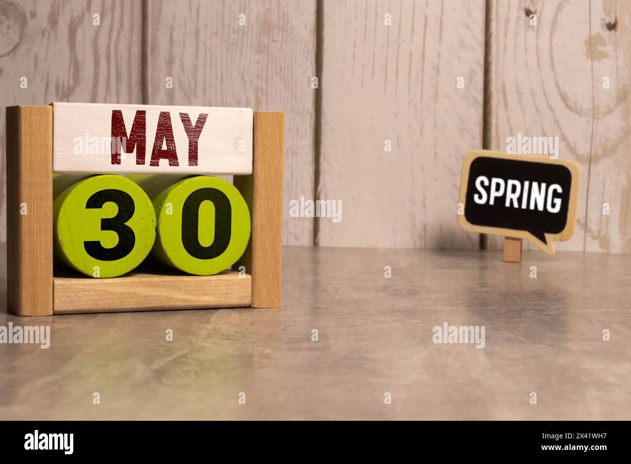 White wooden calendar on grunge concrete. items to tell date, symbol of ...