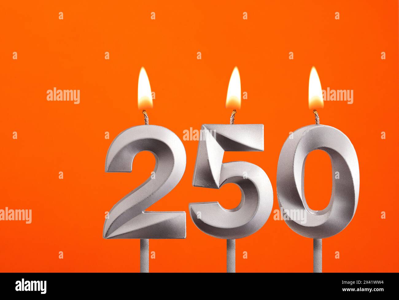 Candle number 250 - Birthday in orange background Stock Photo - Alamy