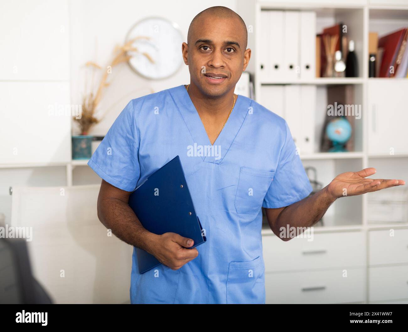 Doctor man wearing stethoscope blue hi-res stock photography and images ...