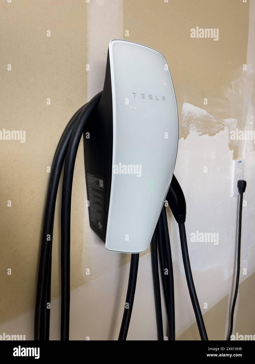 Tesla Wall Connector Installed in a Home Garage for Electric Car ...