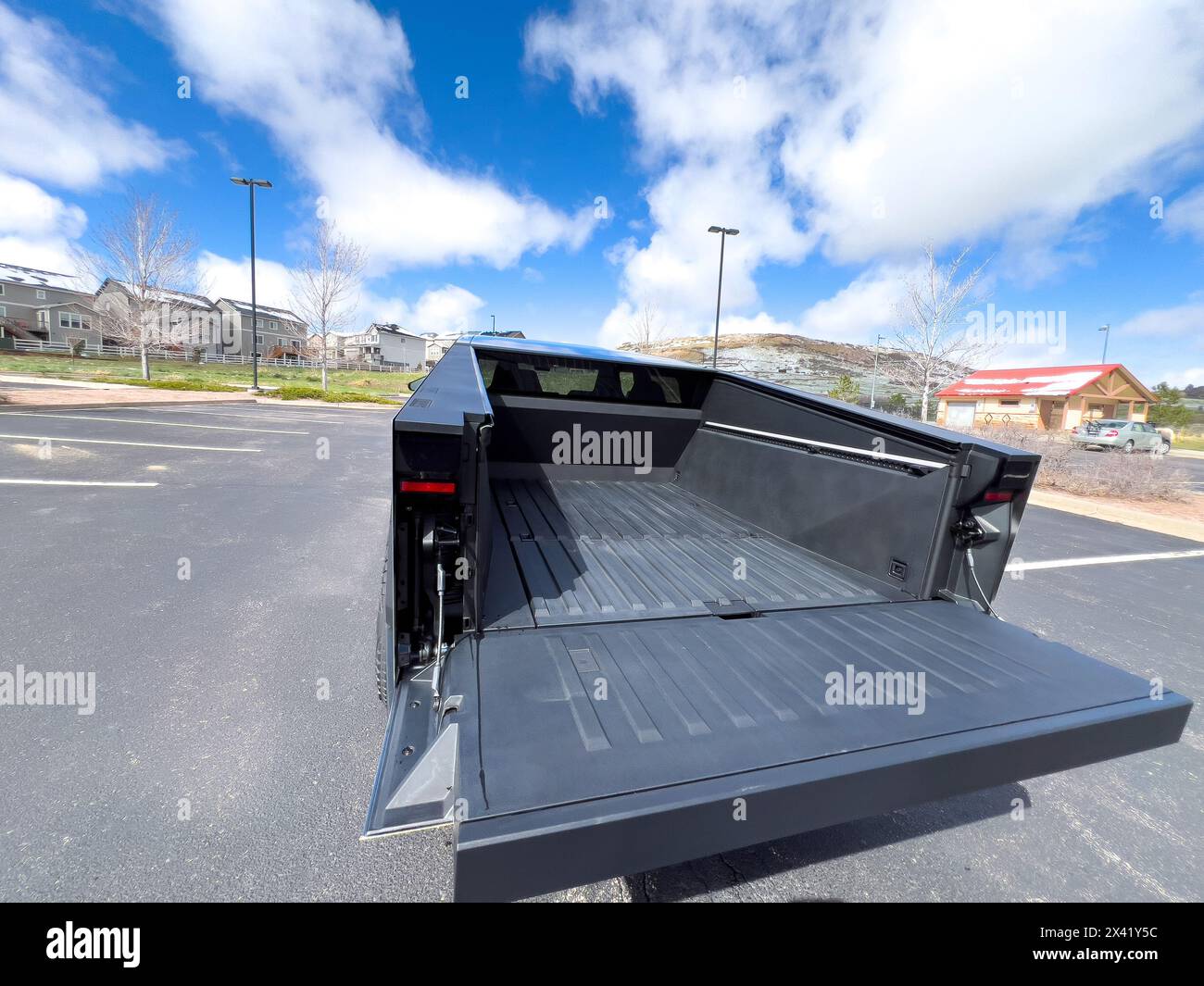 Back View of a Tesla Cybertruck in an Empty Suburban Parking Lot Stock ...