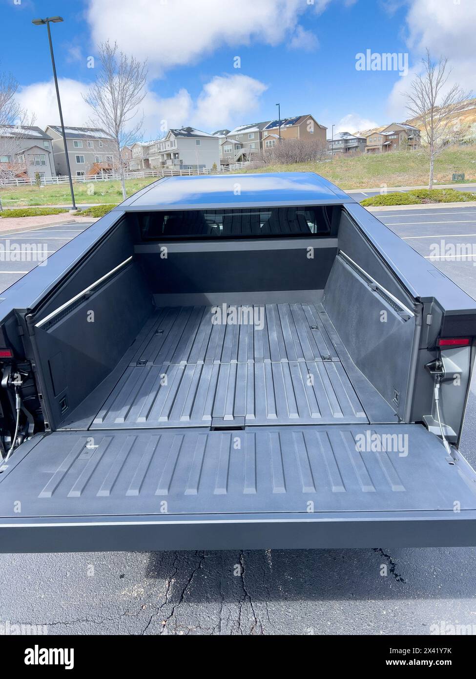 Back View of a Tesla Cybertruck in an Empty Suburban Parking Lot Stock ...