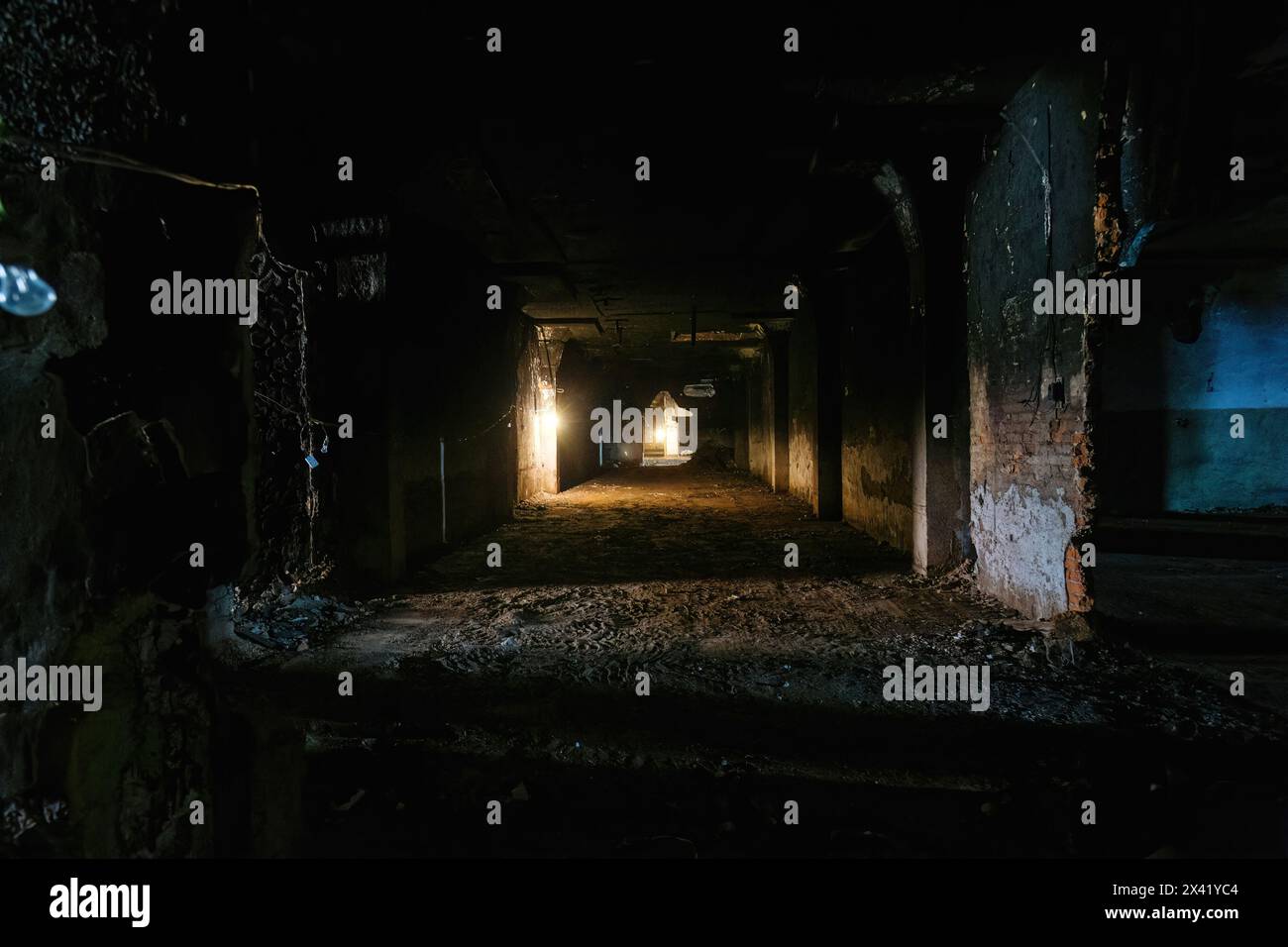 Burnt interior of industrial building basement. Walls in black soot ...