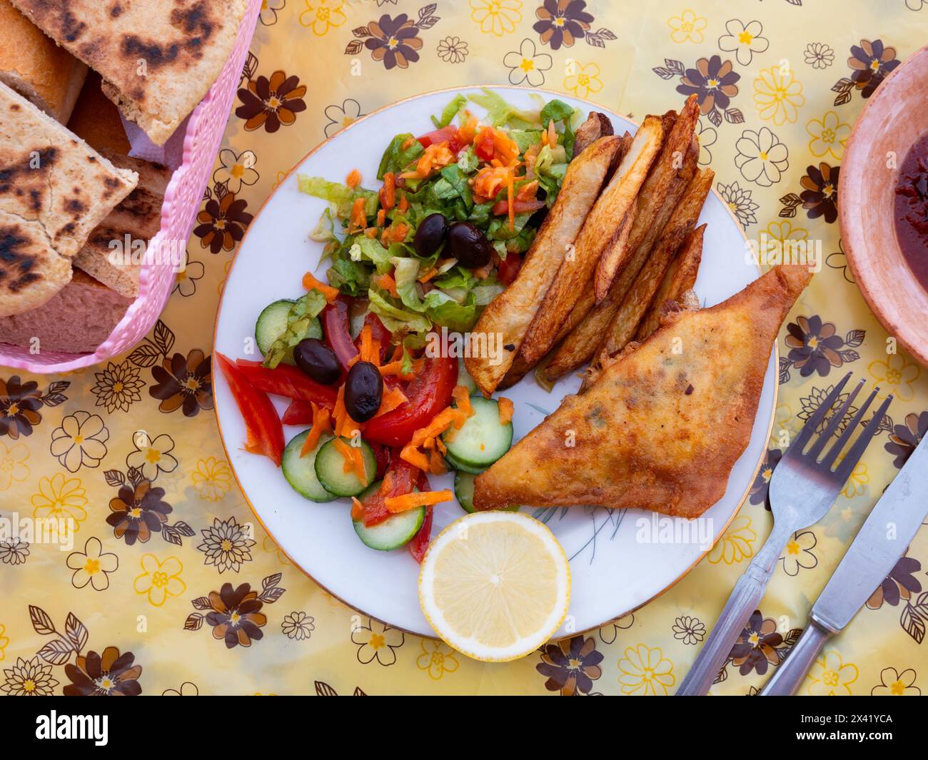 Tunisian brik pie served with vegetable salad Stock Photo - Alamy
