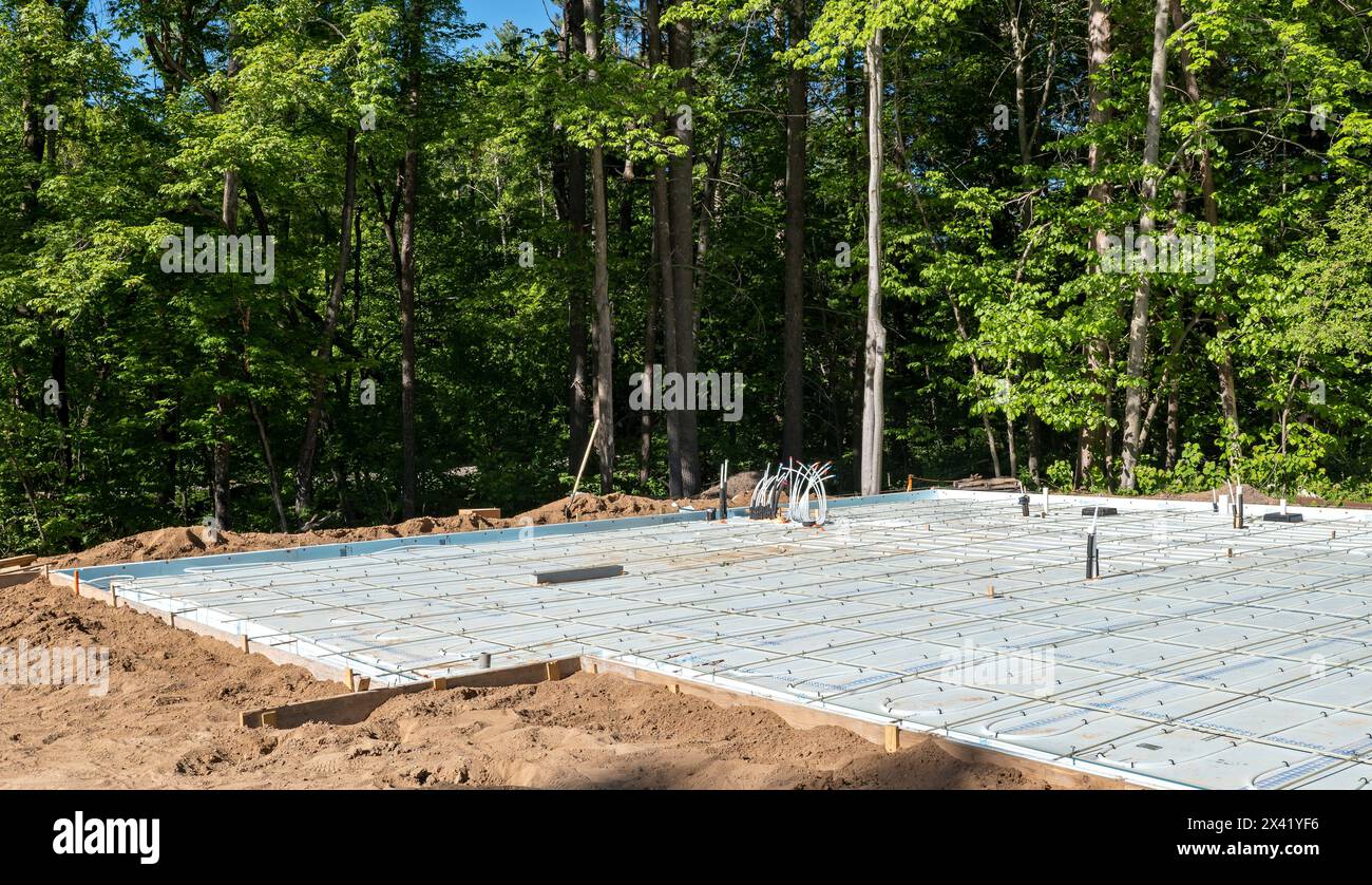 Foam insulation and under floor heating tubes partially installed, and ...