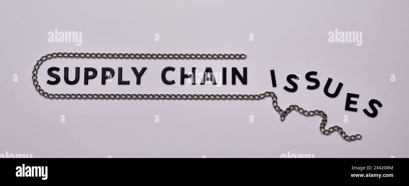Supply Chain issues concept. Black letters with steel chain Stock Photo ...