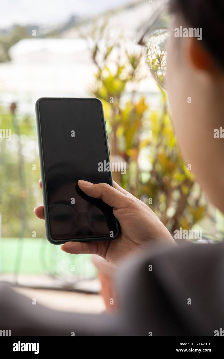 using a smart cell phone with touch screen, work and communication tool ...