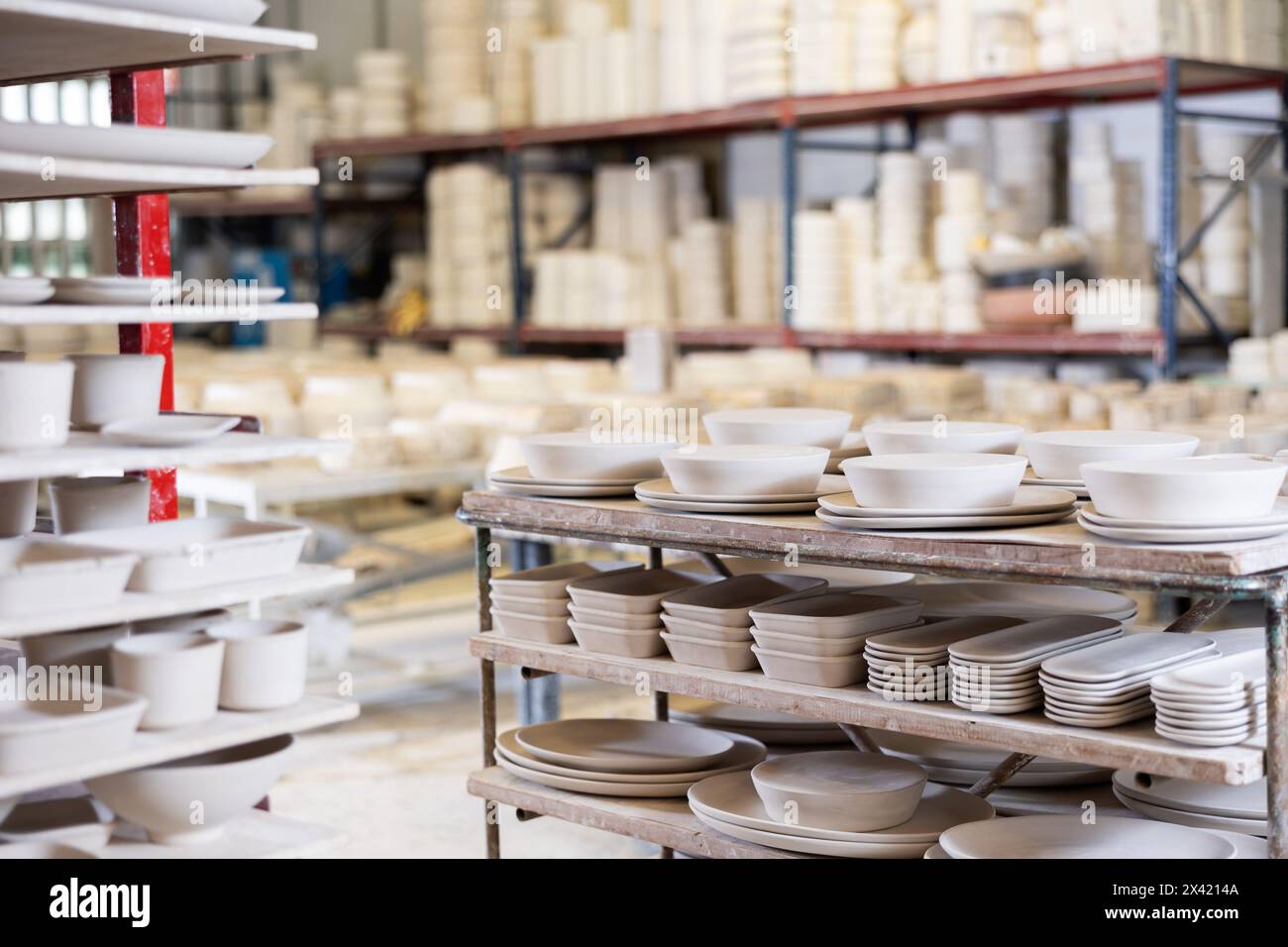 Ceramic dishes blanks on factory rack Stock Photo - Alamy