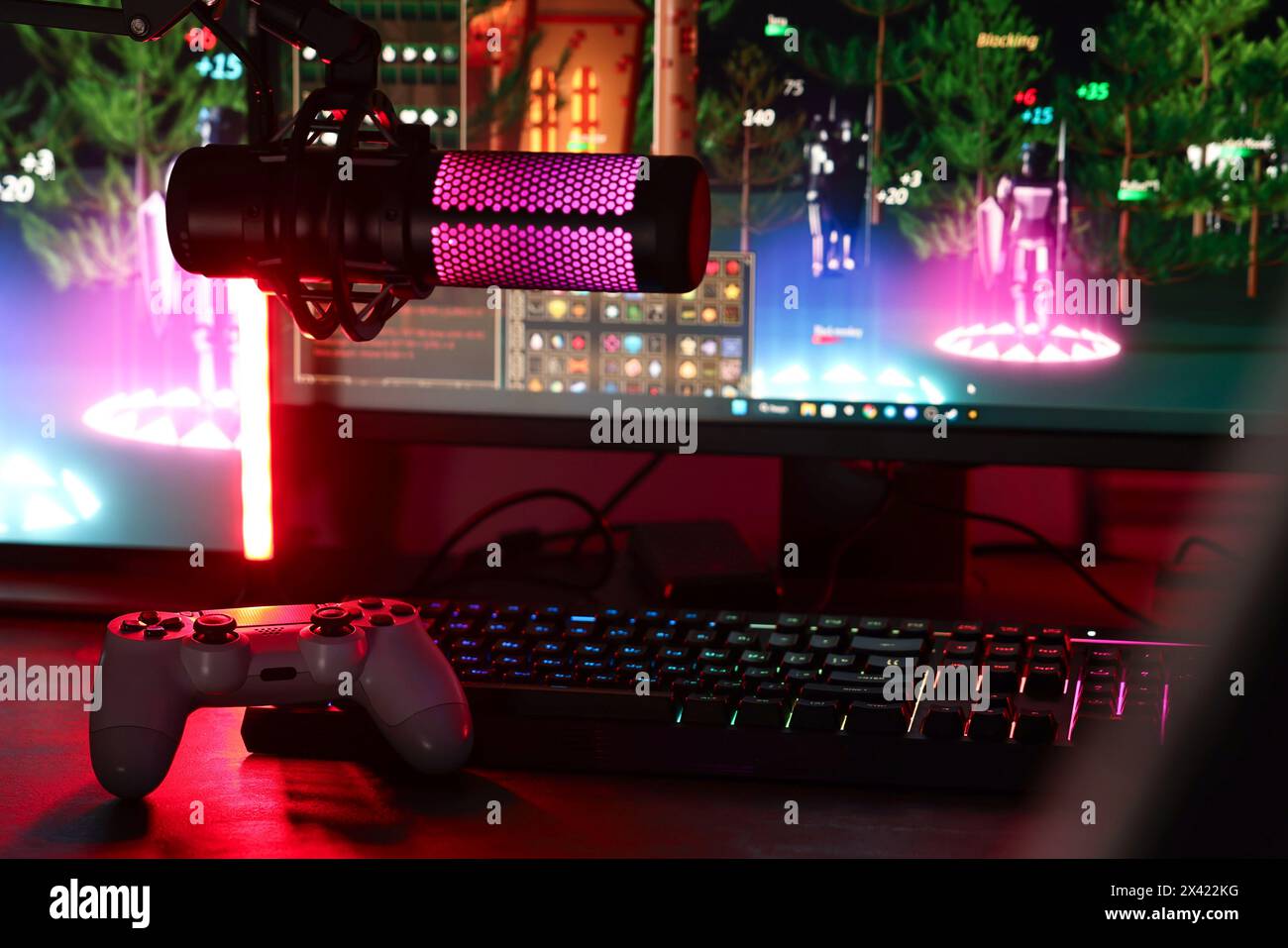 Playing video games. Modern computer, microphone and wireless ...
