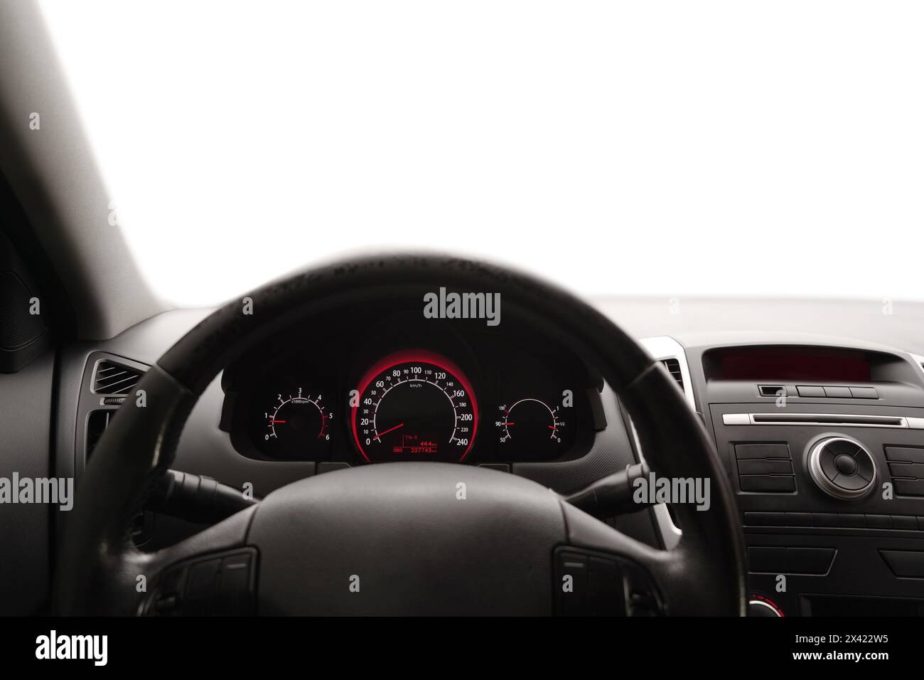 Speedometer on dashboard and steering wheel inside car Stock Photo - Alamy