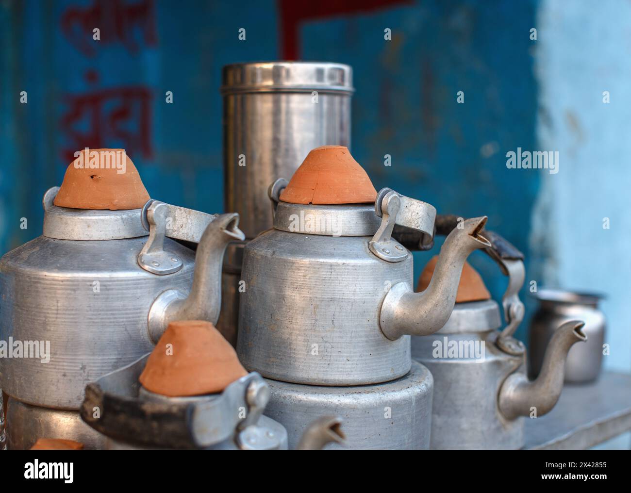 Four metal kettles with clay bowls as lids in Varanasi, India Stock ...