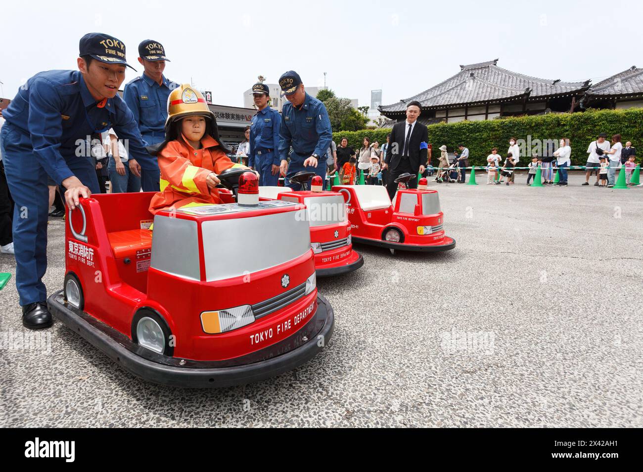 Tokyo, Japan. 29th Apr, 2024. Firefighters help children ride in toy ...