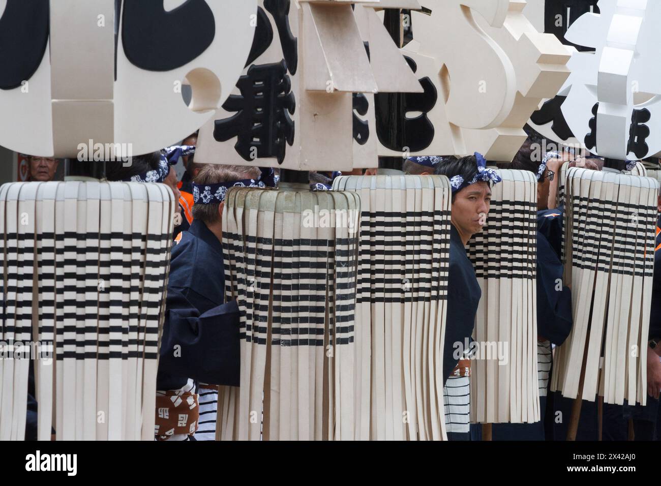 Tokyo, Japan. 29th Apr, 2024. Men wearing festival jackets stand by ...