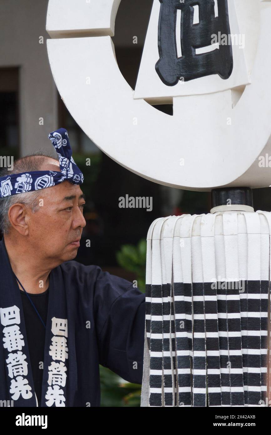 Tokyo, Japan. 29th Apr, 2024. Men wearing festival jackets stand by ...