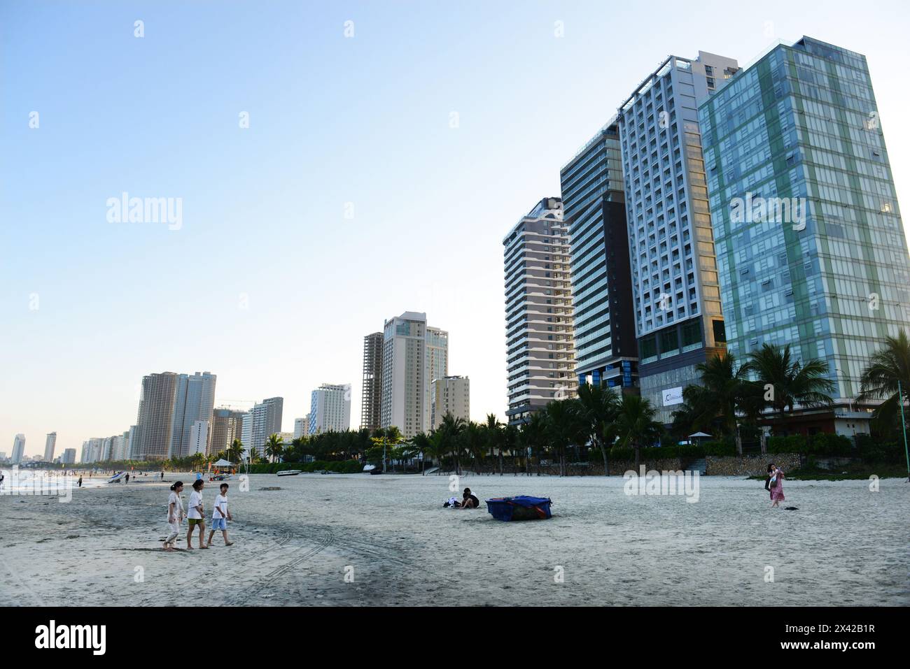 The beautiful long white sand beach along the changing waterfront ...