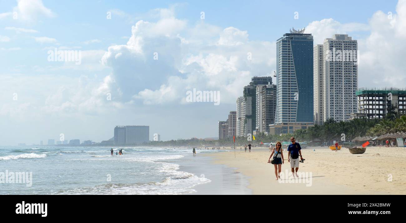 The beautiful long white sand beach along the changing waterfront ...