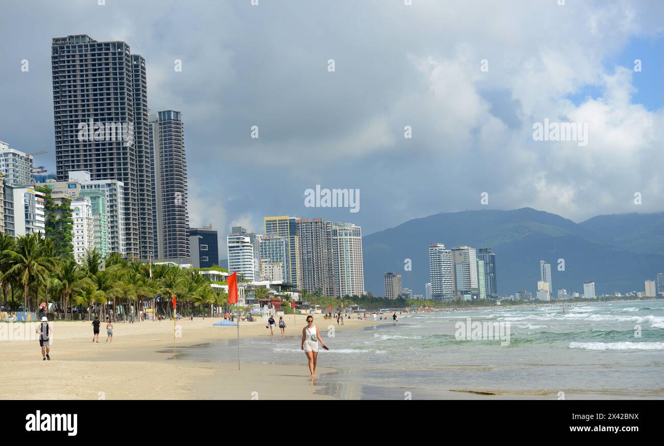 The beautiful long white sand beach along the changing waterfront ...