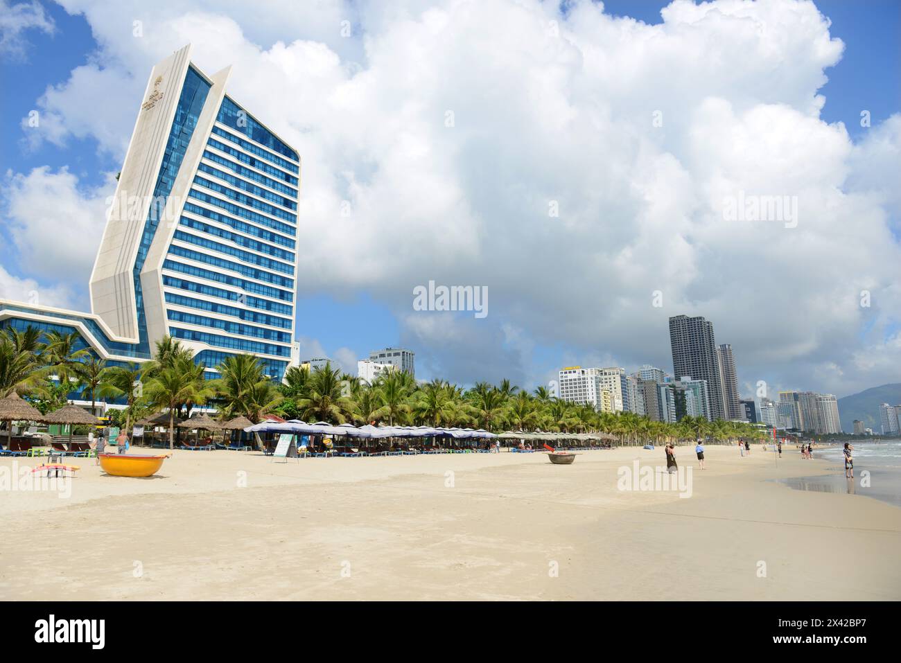 The beautiful long white sand beach along the changing waterfront ...