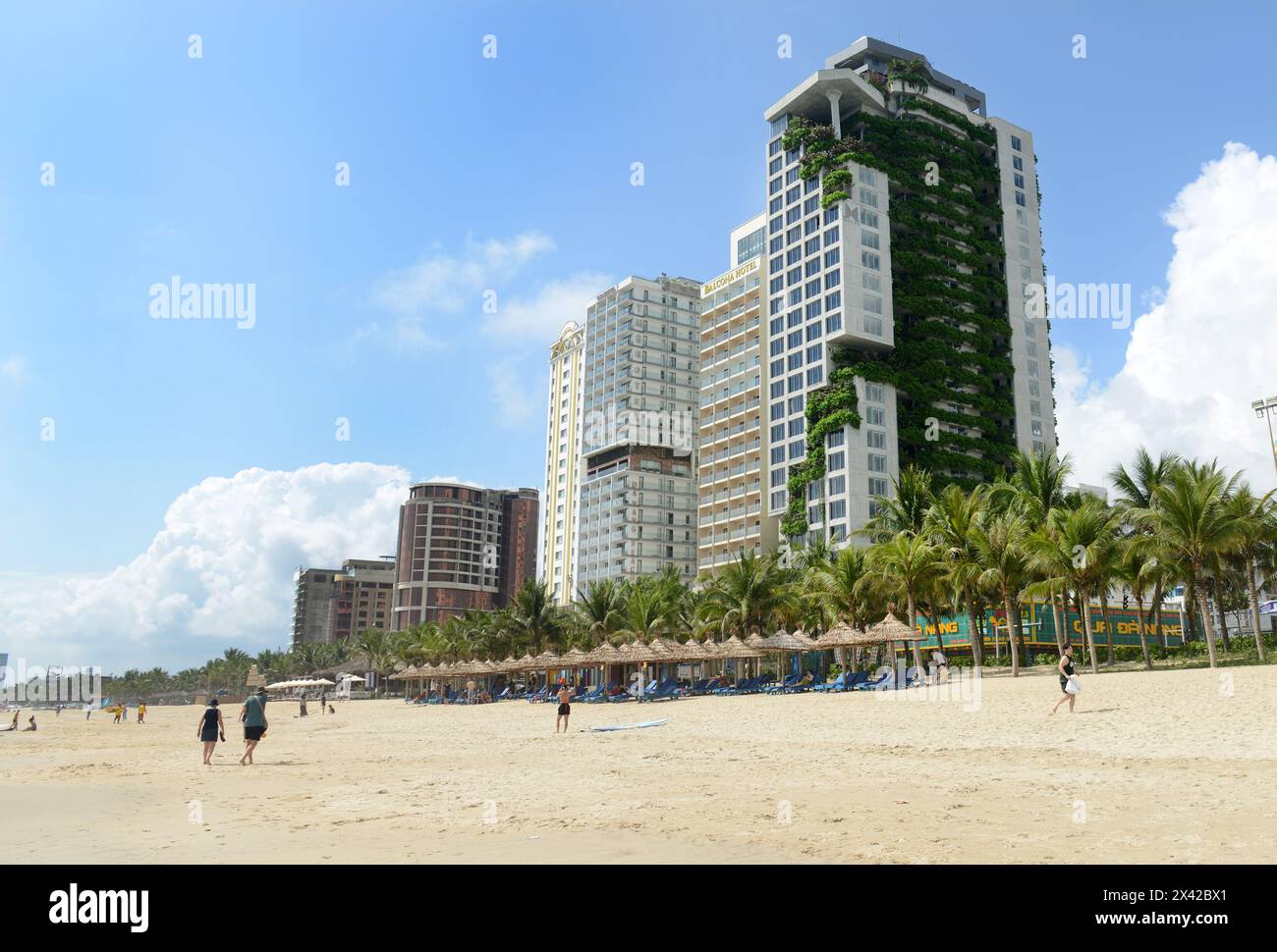 The beautiful long white sand beach along the changing waterfront ...