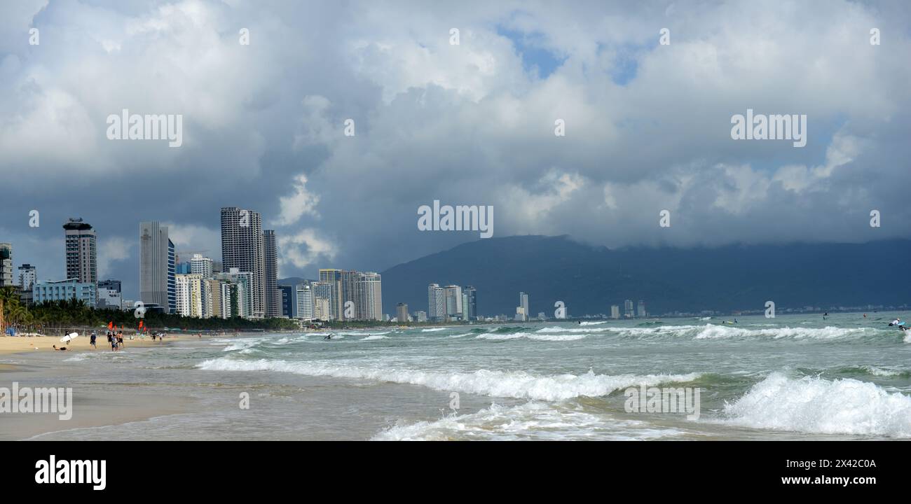 The beautiful long white sand beach along the changing waterfront ...
