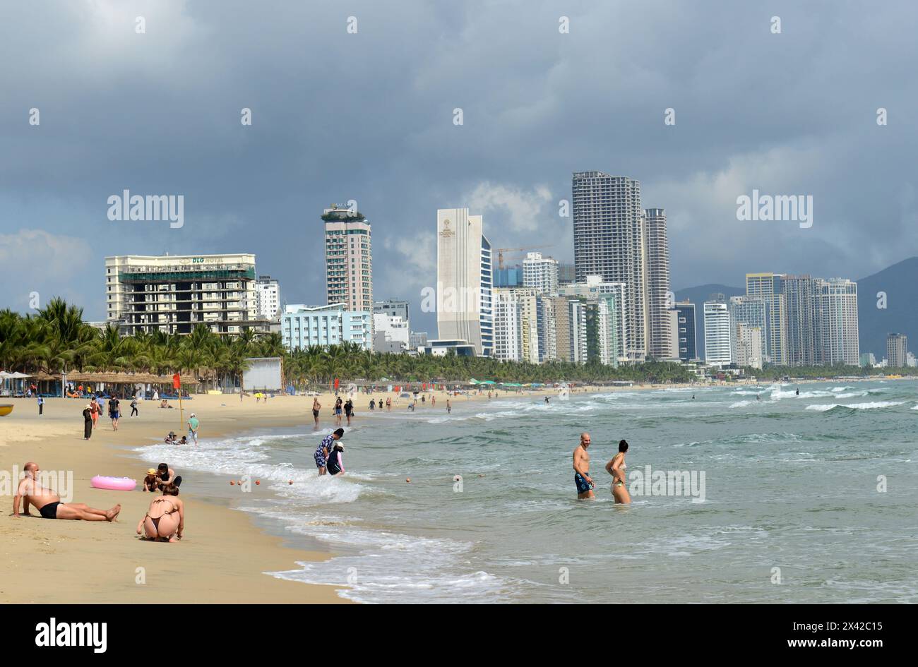 The beautiful long white sand beach along the changing waterfront ...