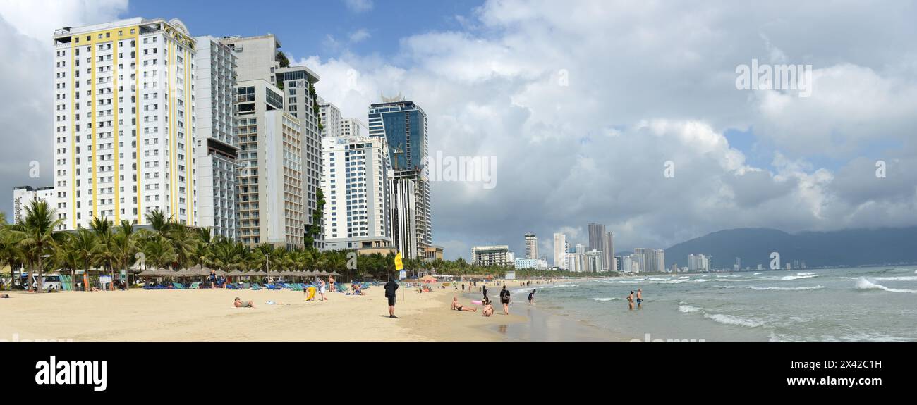 The beautiful long white sand beach along the changing waterfront ...